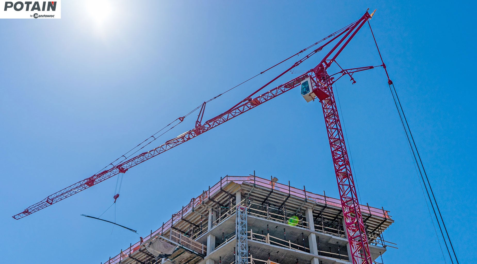 NY contractor manages a tight fit with a Potain Igo T 130 Self-Erecting ...